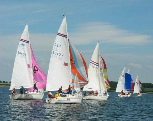 The fleet sails downwind at the 2003 Hunter Formula One Nationals