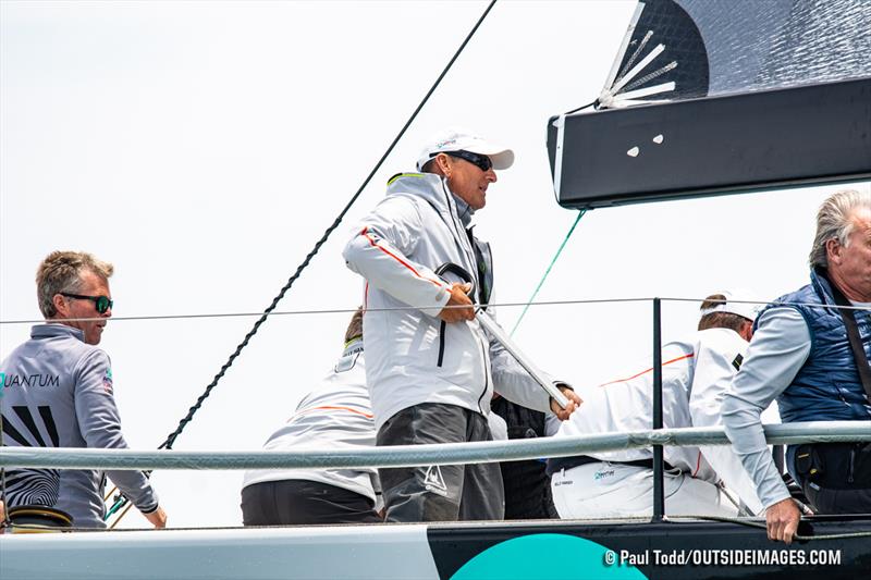 Doug Devos, on the helm, rounds the weather mark on his TP52 Windquest ...