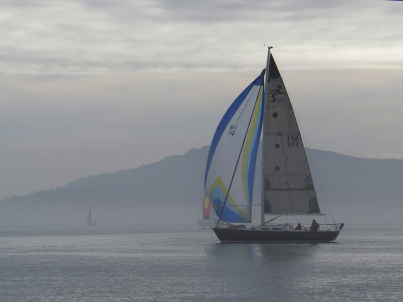 Hank Easom and Hans List drift with the current. Their Sabre Spirit 36 ...