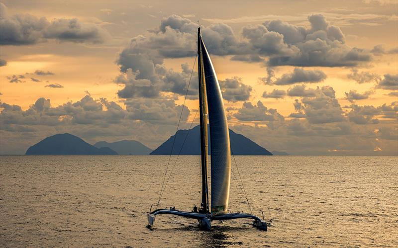 Riccardo Pavoncelli's MOD70 trimaran Mana passes the Aeolian Islands ...