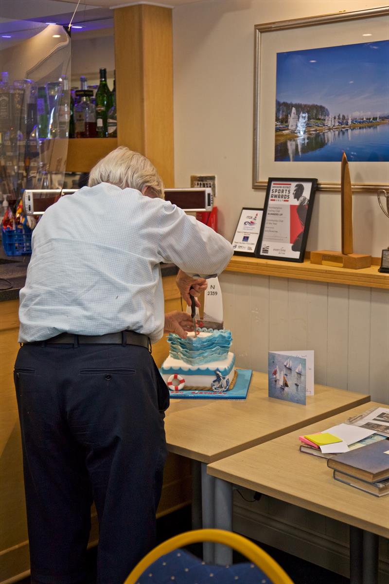 Mike Jackson cuts the cake during the National 12 85th Anniversary ...