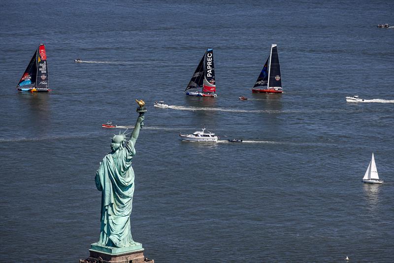 The IMOCA boats in front of the Statue of Liberty in New York during ...